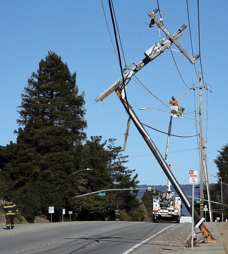 Crash damages power pole, snarls traffic