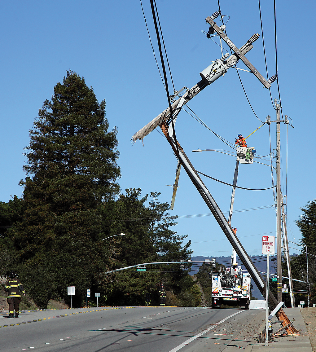 Crash damages power pole, snarls traffic